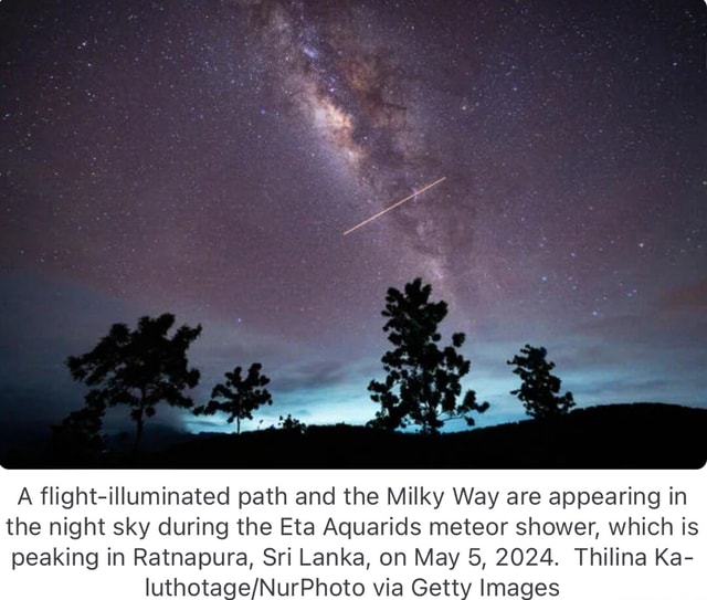 A flight-illuminated path and the Milky Way are appearing in the night ...