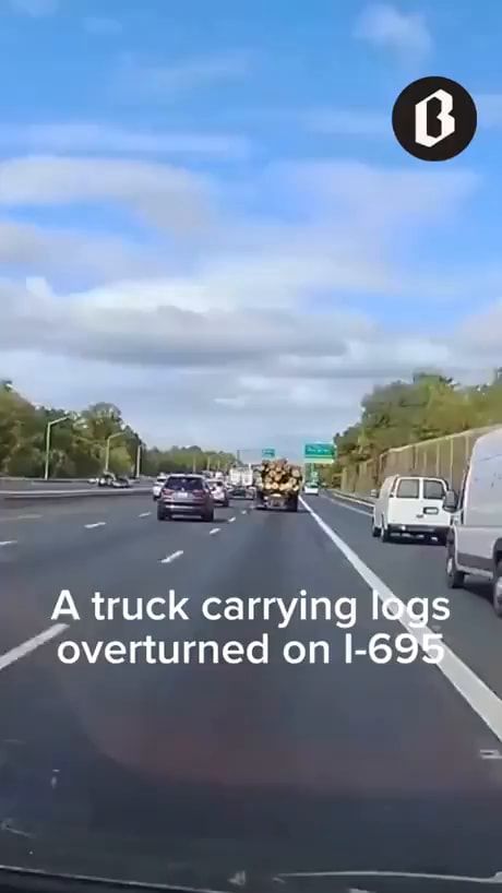 A truck carrying logs overturned on I-695 - America’s best pics and videos